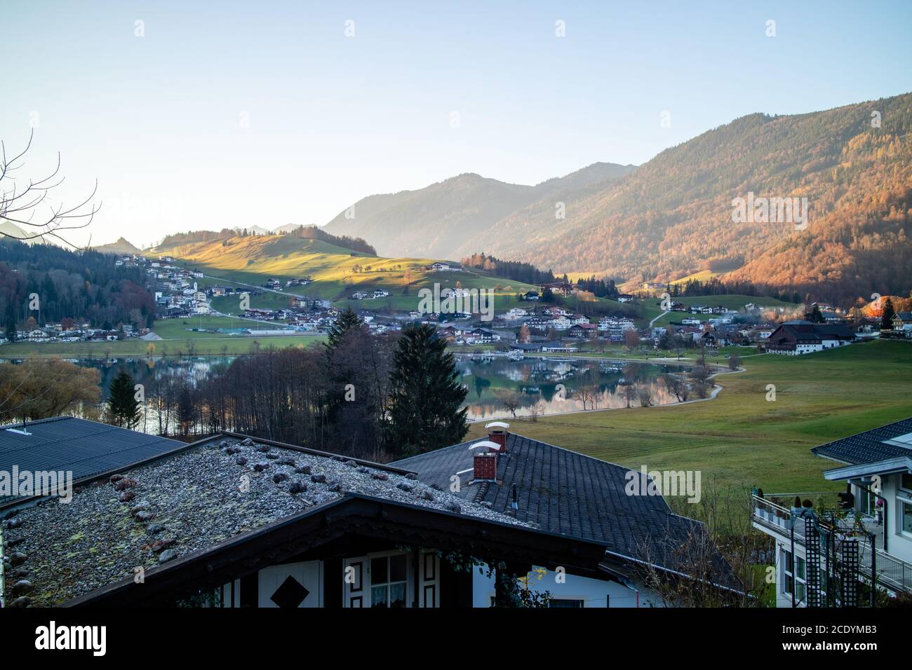 Traditional rural landscape with houses, fields and mountains in ...