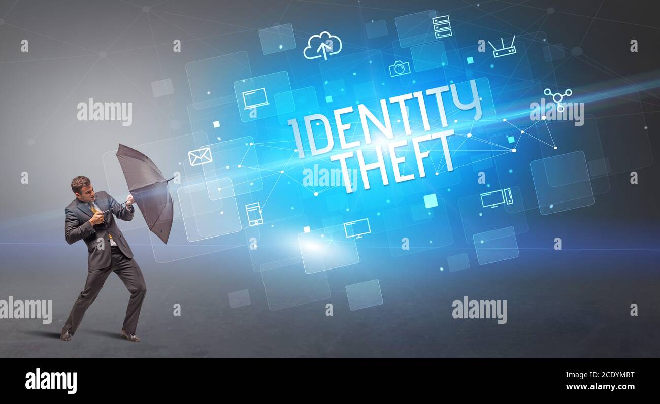 Businessman defending with umbrella from cyber attack and IDENTITY ...