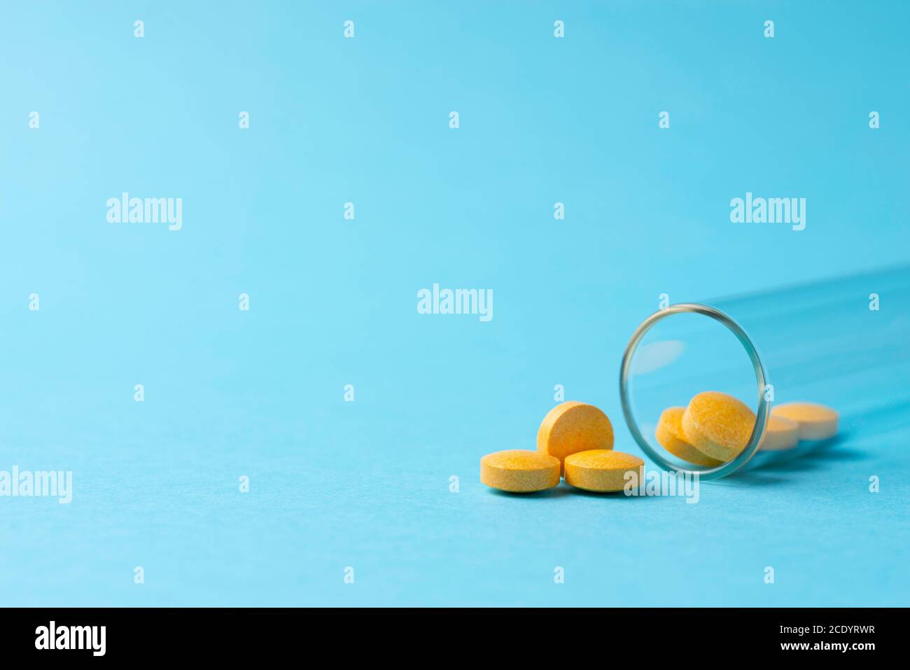 Medical container with various tablets on a blue background Stock Photo ...