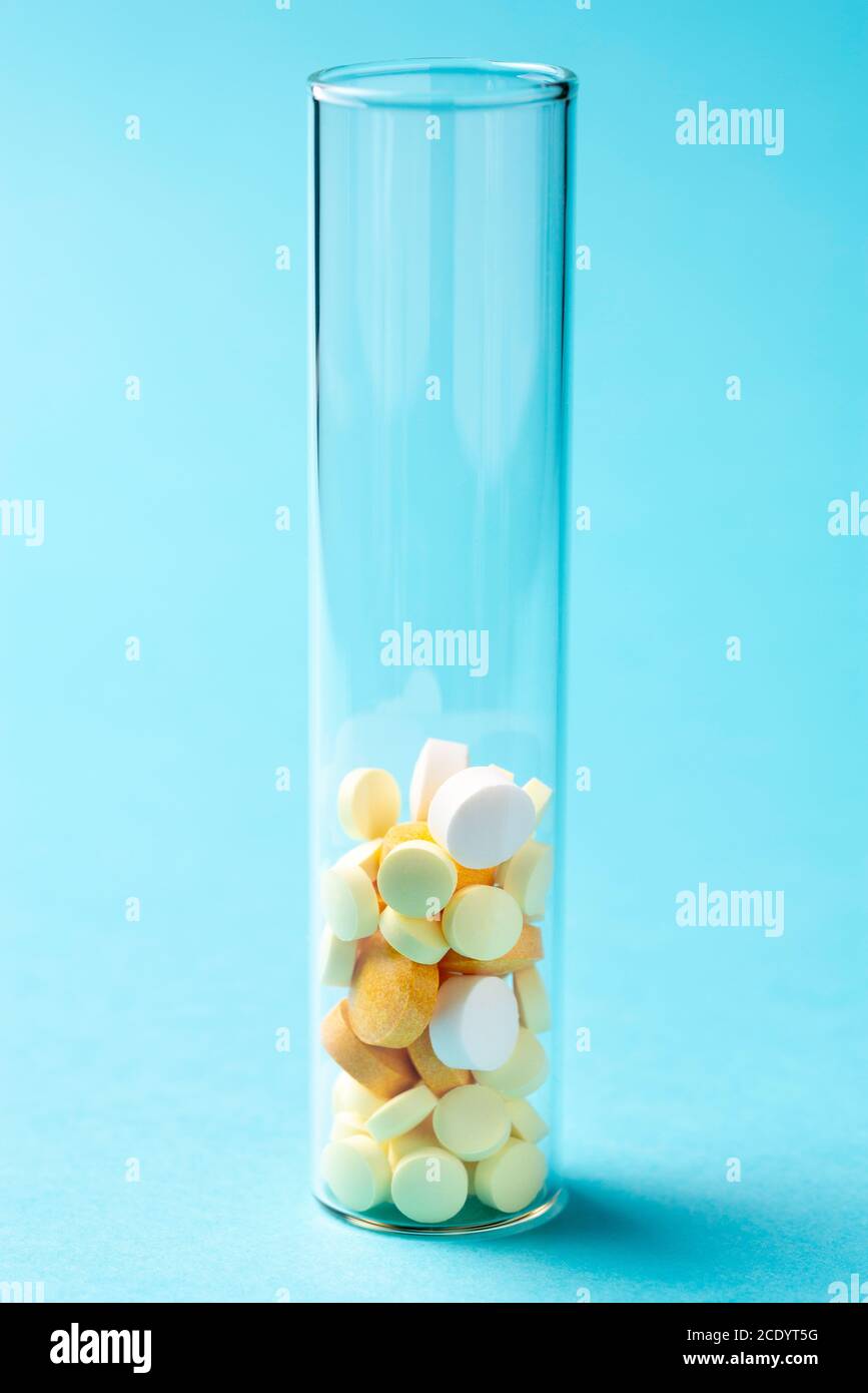 Medical container with various tablets on a blue background Stock Photo ...