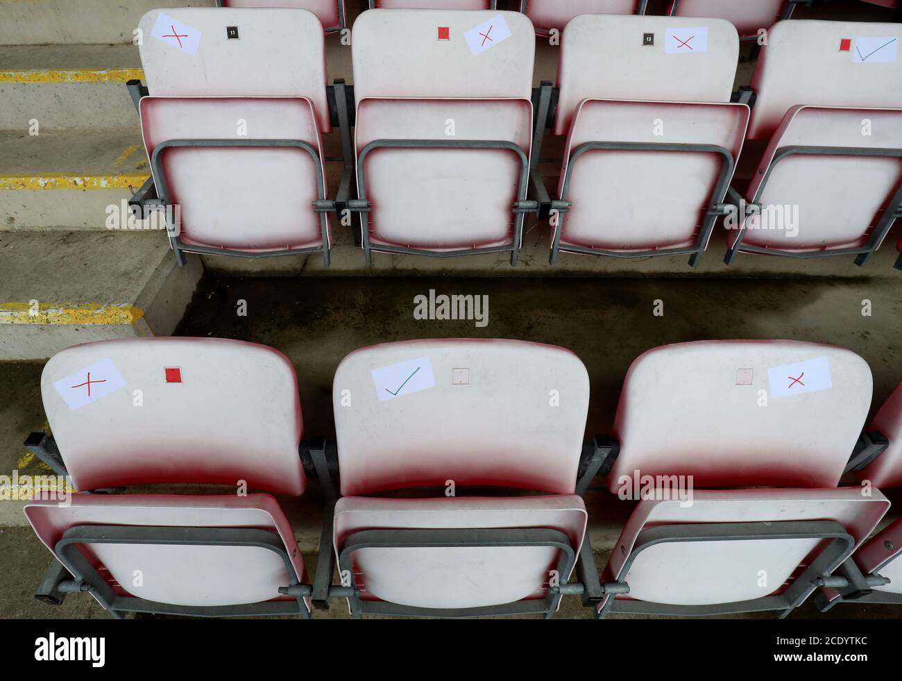 Seats in the stands marked for use during the pre-season friendly match ...