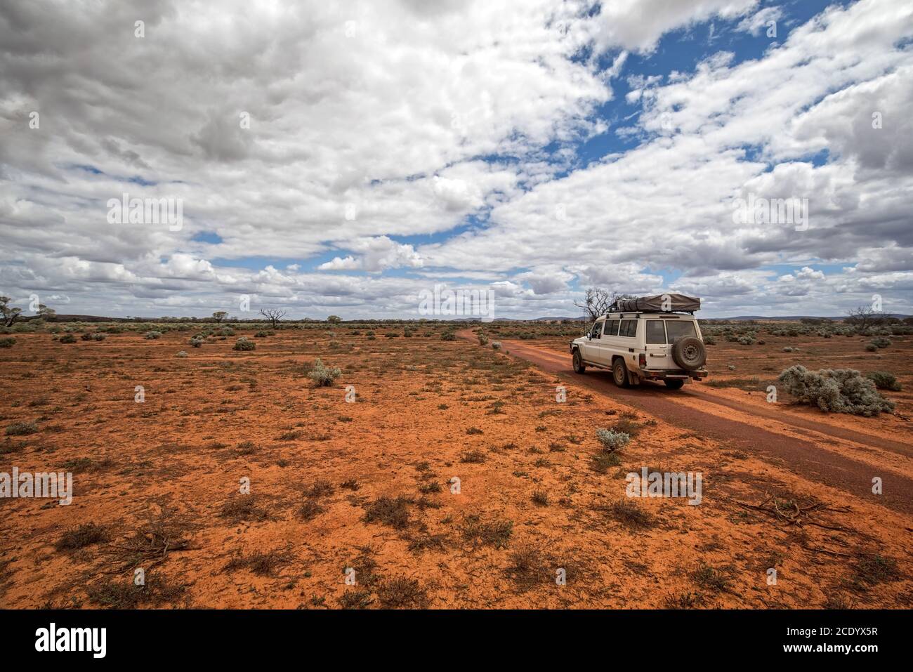 South Australia Outback desert with 4WD track under cloudy sky as ...