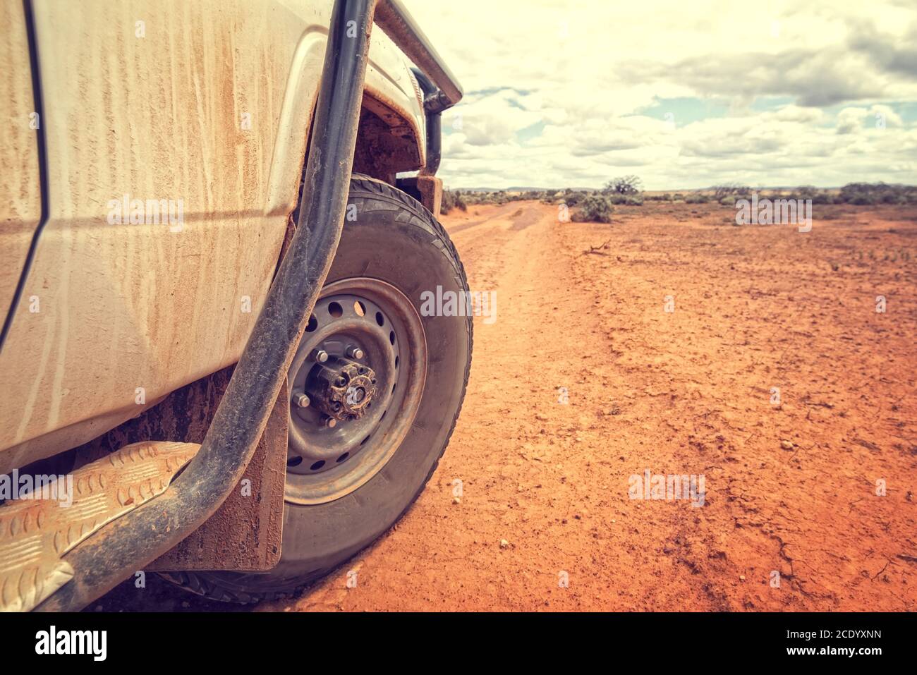 South Australia – Outback desert with 4WD on track under cloudy sky ...