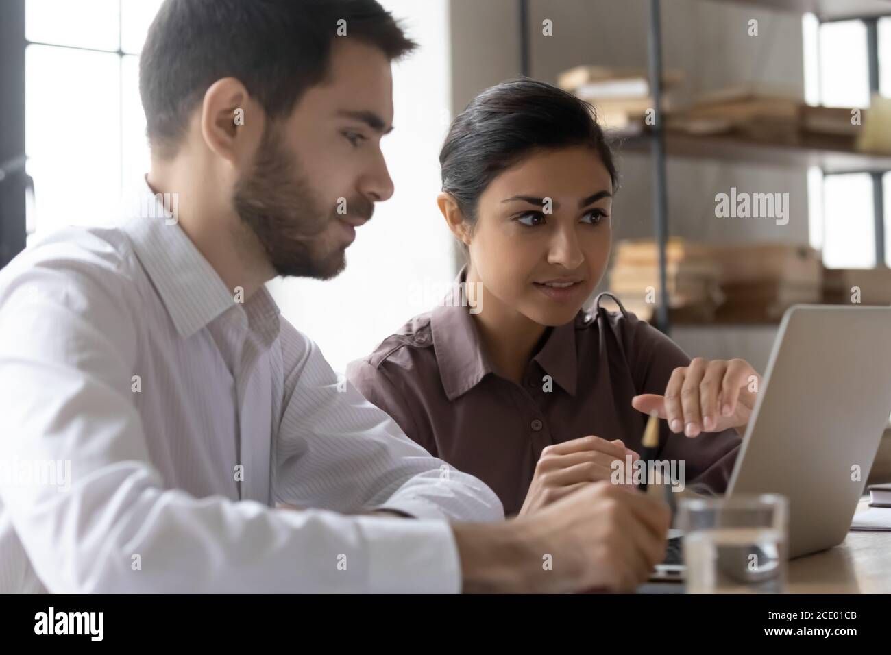 Diverse colleagues using computer application in office Stock Photo - Alamy