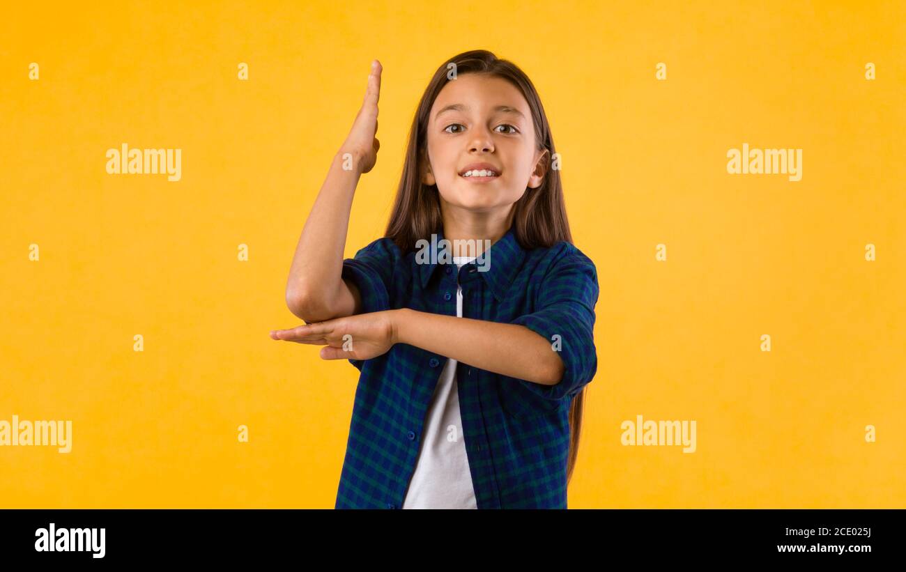 Teenage Girl Raising Her Hand At Studio Stock Photo Alamy