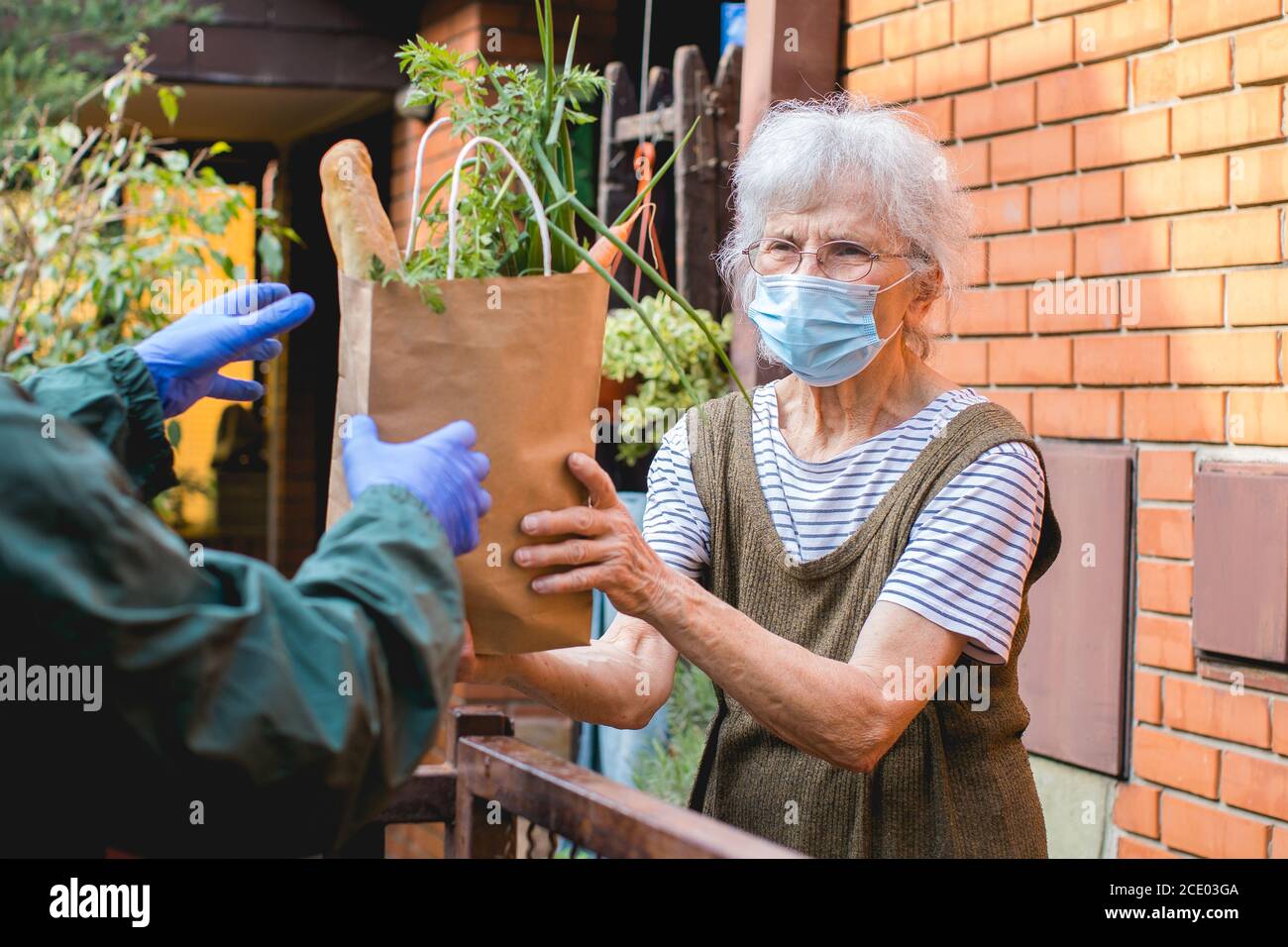 food delivered to elderly person during epidemic lockdown isolation ...