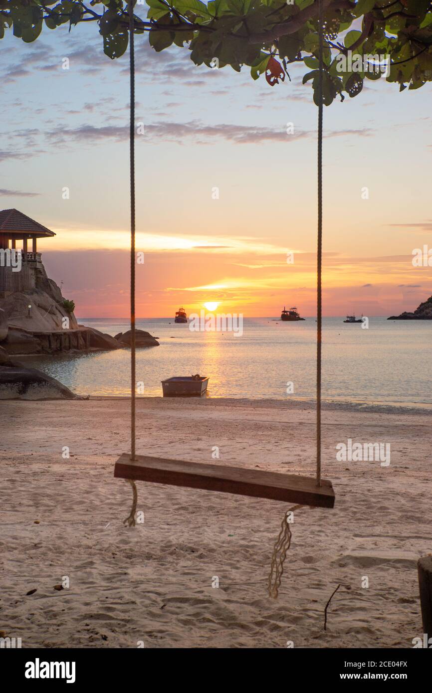 The view of sunset and swing Stock Photo - Alamy