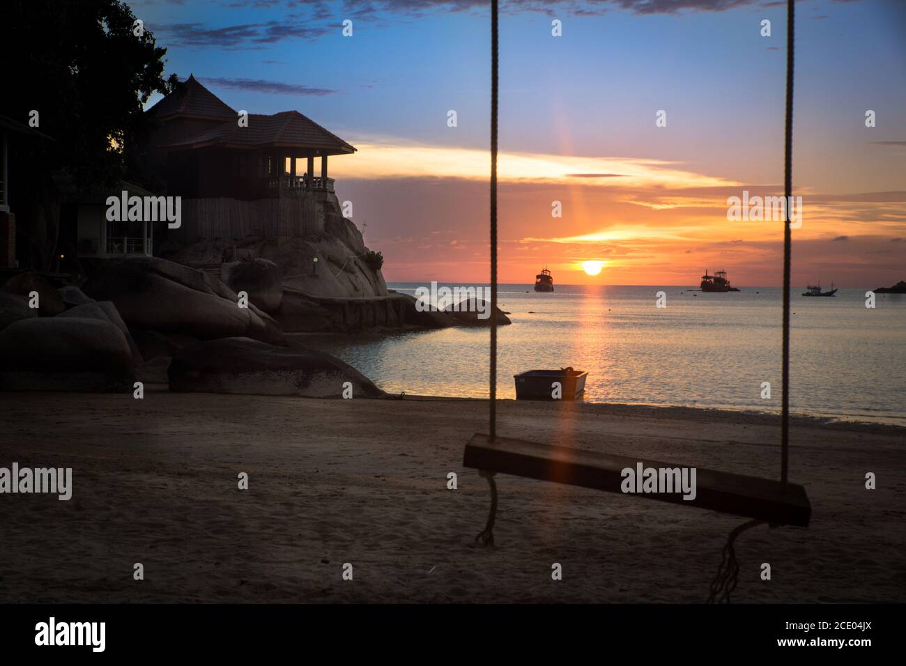 The view of sunset and swing Stock Photo - Alamy