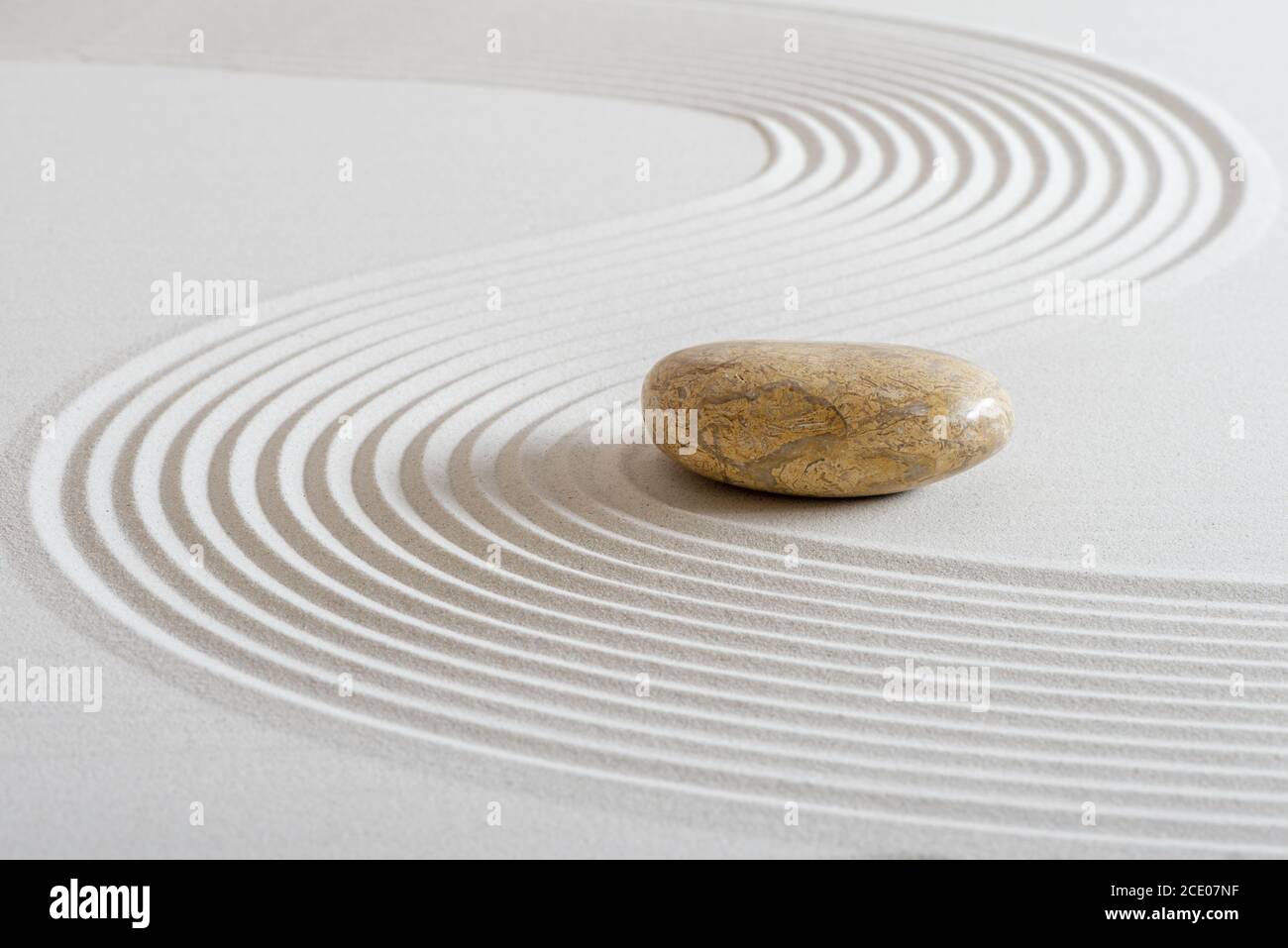 japanese garden with stone in textured sand Stock Photo - Alamy