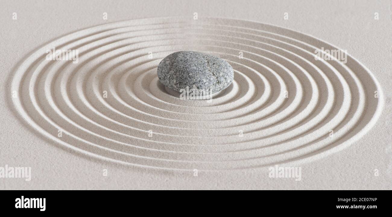 japanese garden with stone in textured sand Stock Photo - Alamy