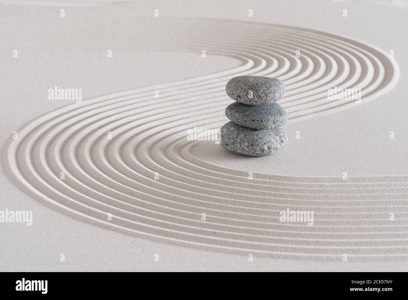 japanese garden with stone in textured sand Stock Photo - Alamy
