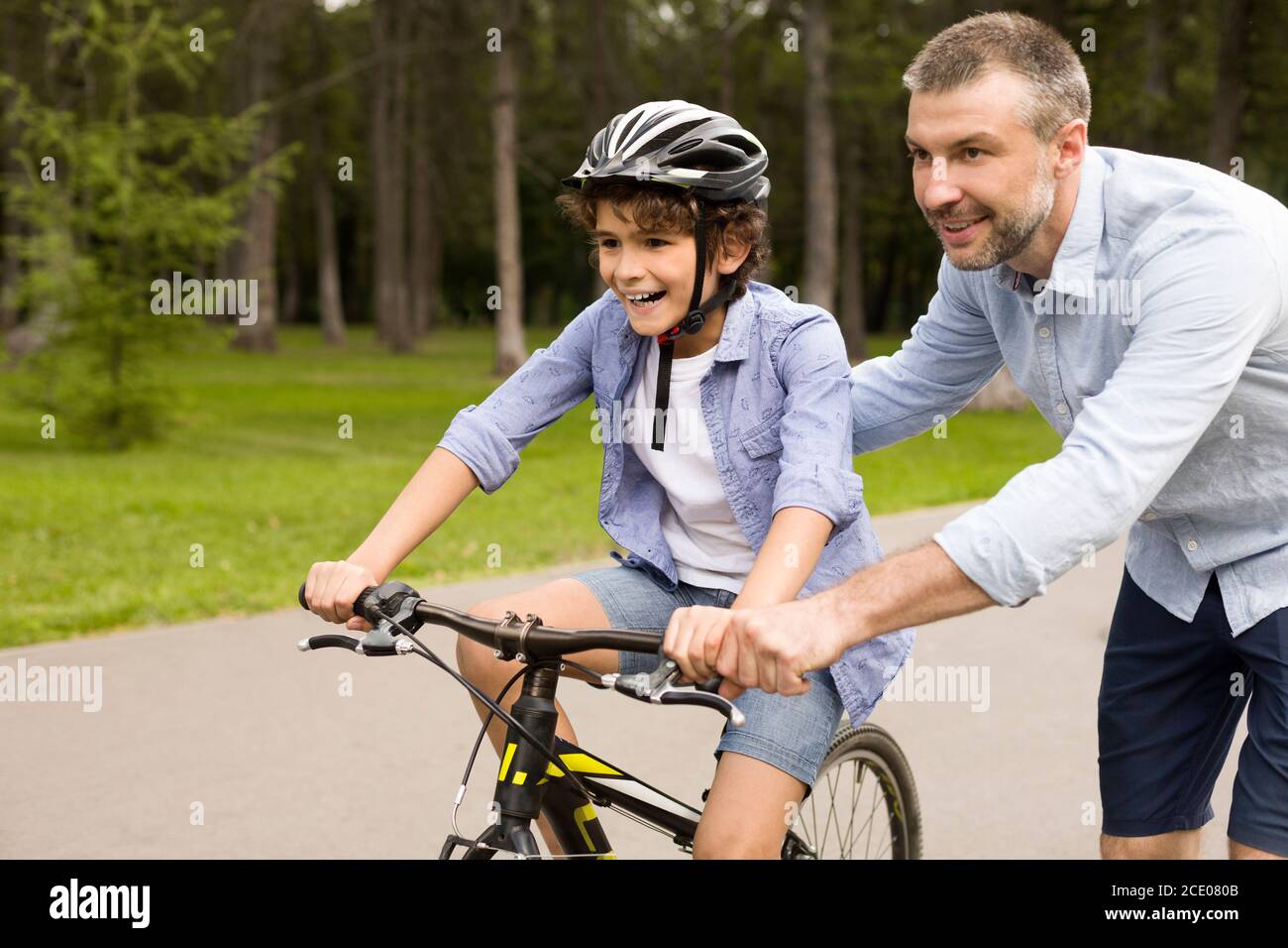 Training how to ride a bicycle hi-res stock photography and images - Alamy