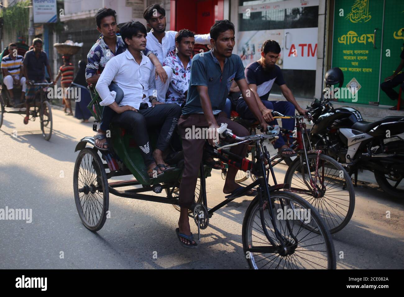 Dhaka, Dhaka, Bangladesh. 30th Aug, 2020. People are riding in riksha ...