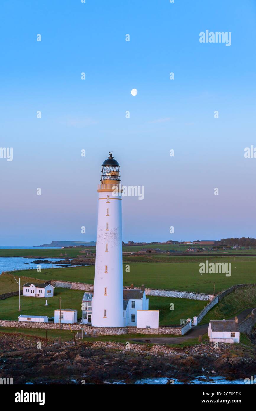 MONTROSE SCOTLAND - 2015 MAY 07. Scurdie Ness lighthouse with full moon ...