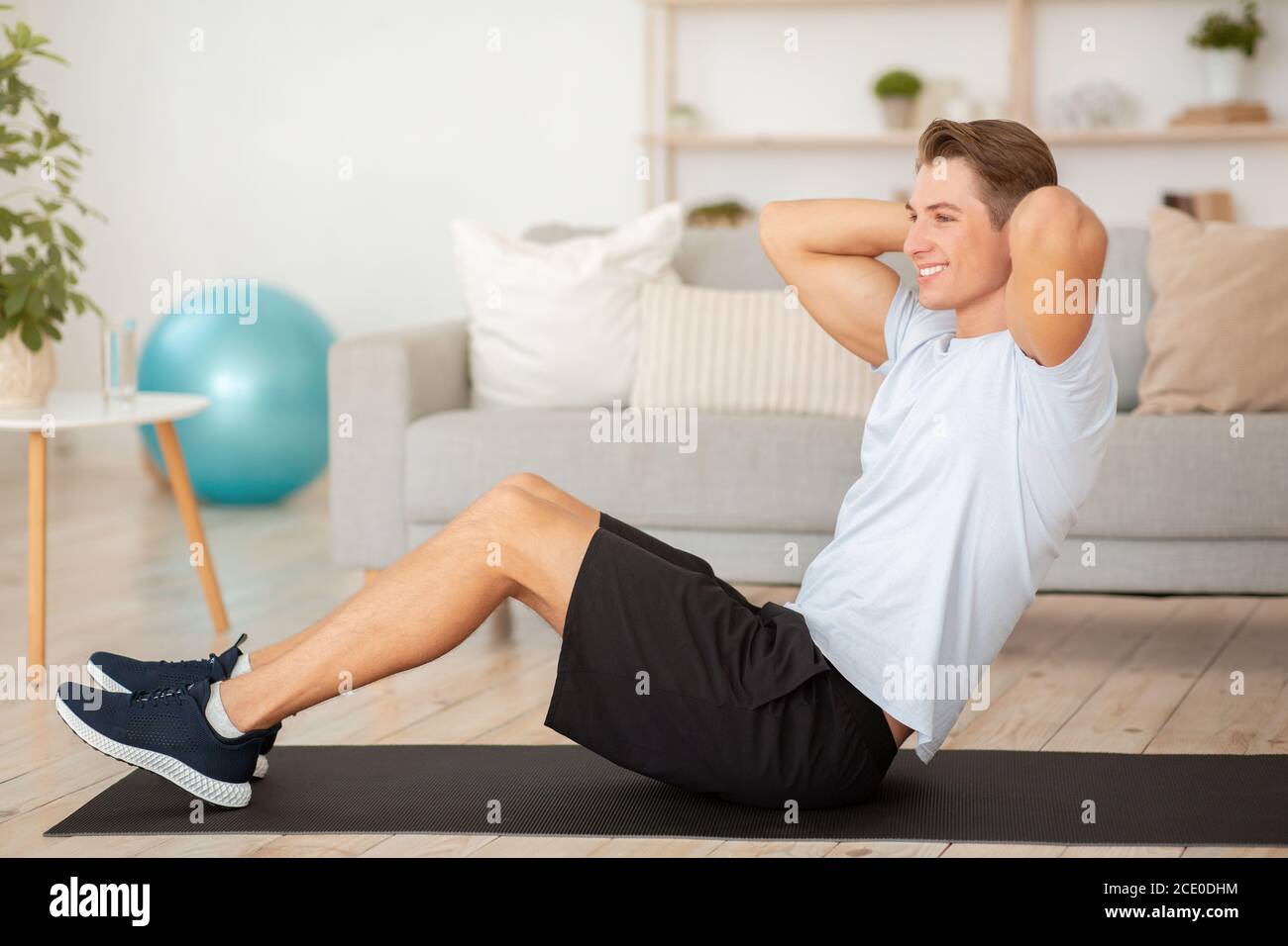 Abs exercise. Happy guy doing morning workout for healthy lifestyle ...
