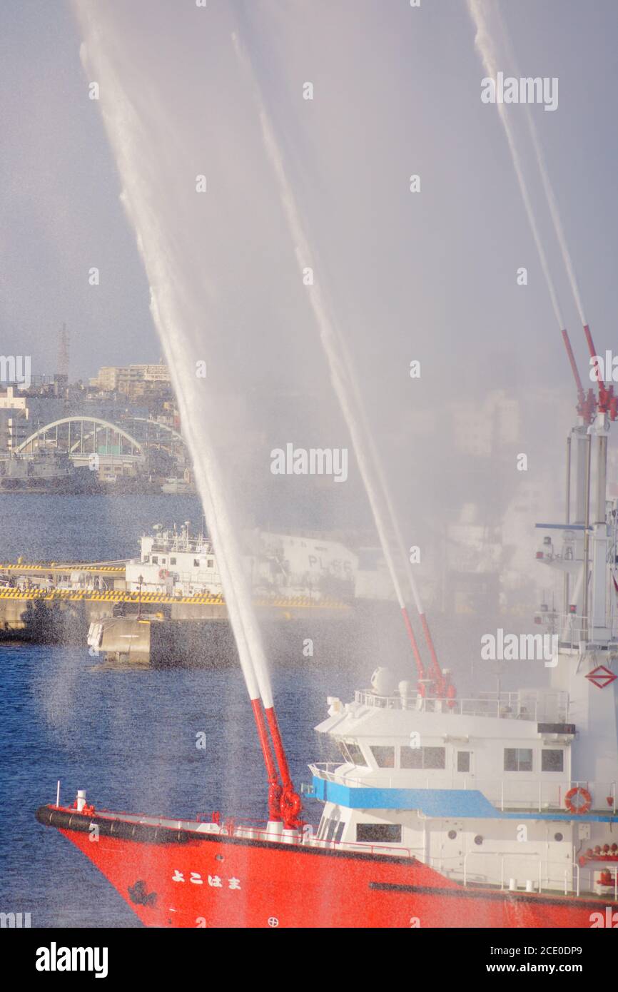 Fire fighting vessels to the water discharge training Stock Photo - Alamy
