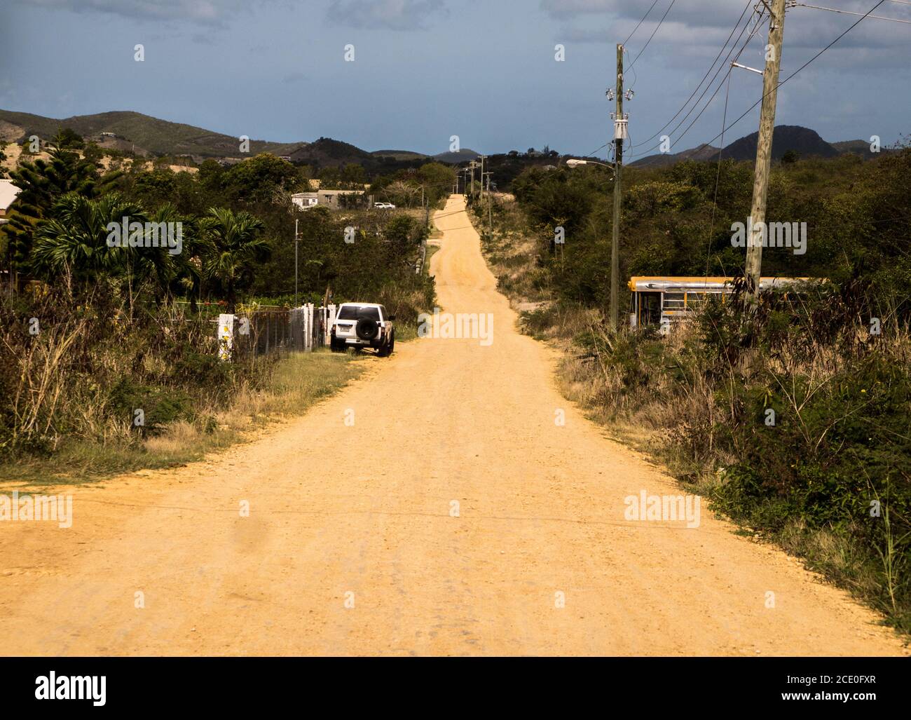 Dusty track running straight across Antigua Stock Photo - Alamy