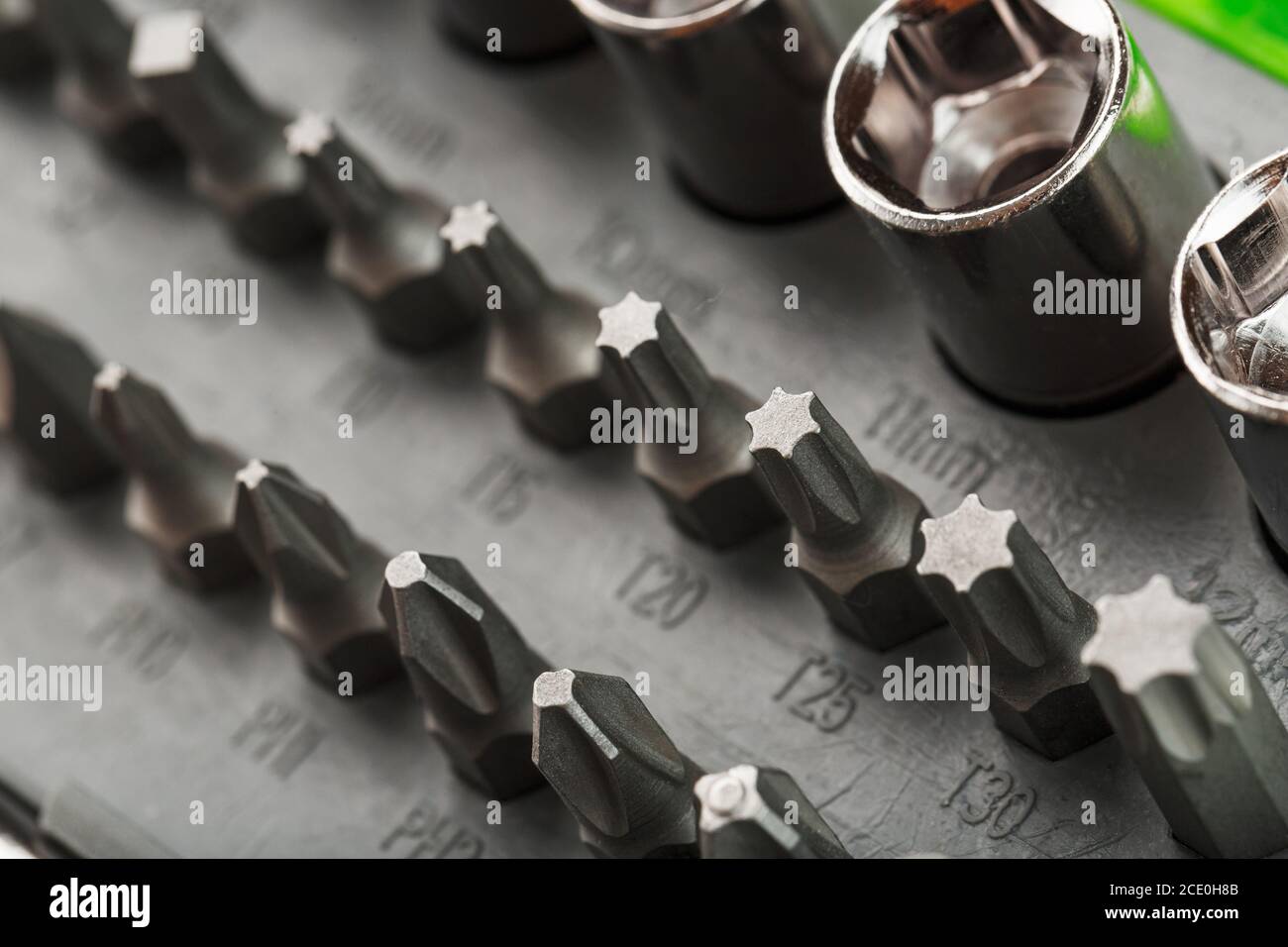 Tool box with attachments and bits of different shapes and sizes close ...