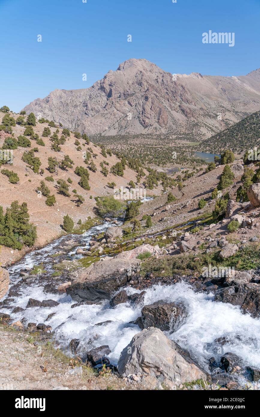 The beautiful mountain trekking road with clear blue sky and rocky ...