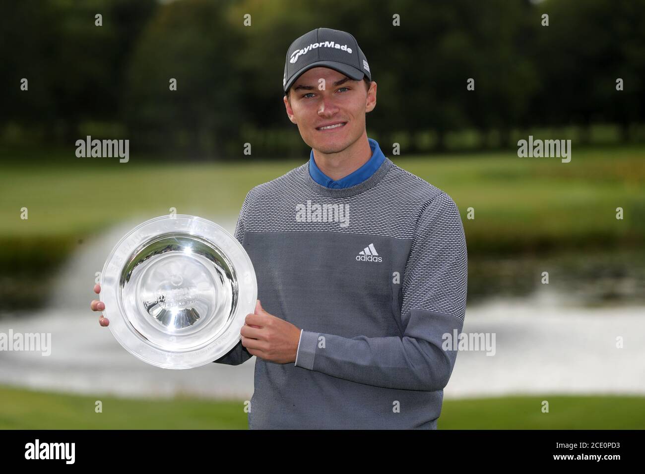 Denmark's Rasmus Hojgaard poses with the trophy after winning the ISPS ...