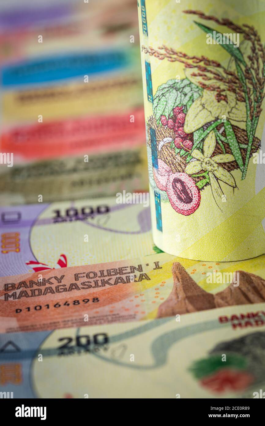 Madagascar money, 20,000 ariary banknote rolled up and lying on the ...