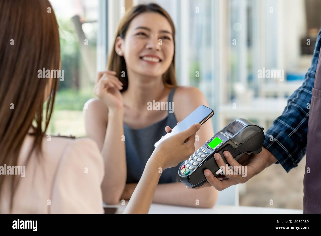 Asian woman nfc payment hi-res stock photography and images - Alamy