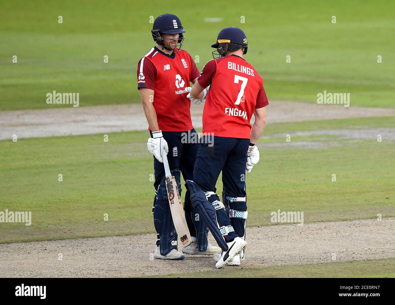 England's Dawid Malan (left) and Sam Billings bump fists during the ...