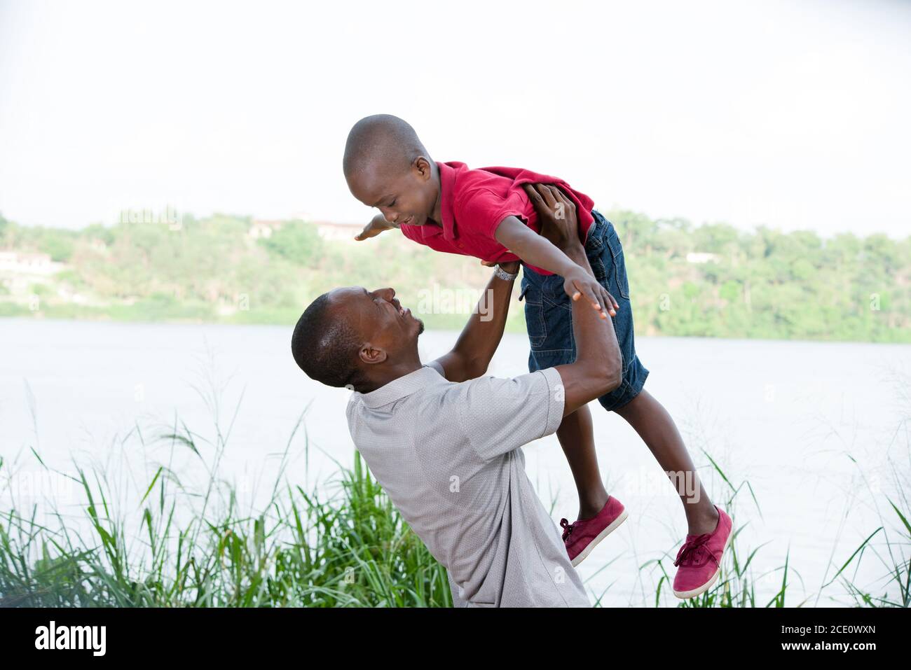 happy family in nature, father and son spending a pleasant time ...