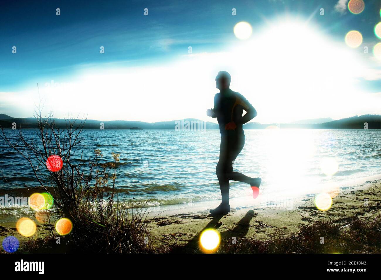Film grain. Silhouette of tall sport active man running and exercising ...
