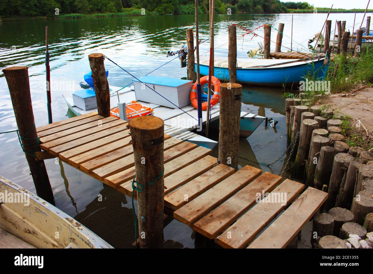rustic craft marina on a swampy river where small boats moor in the ...