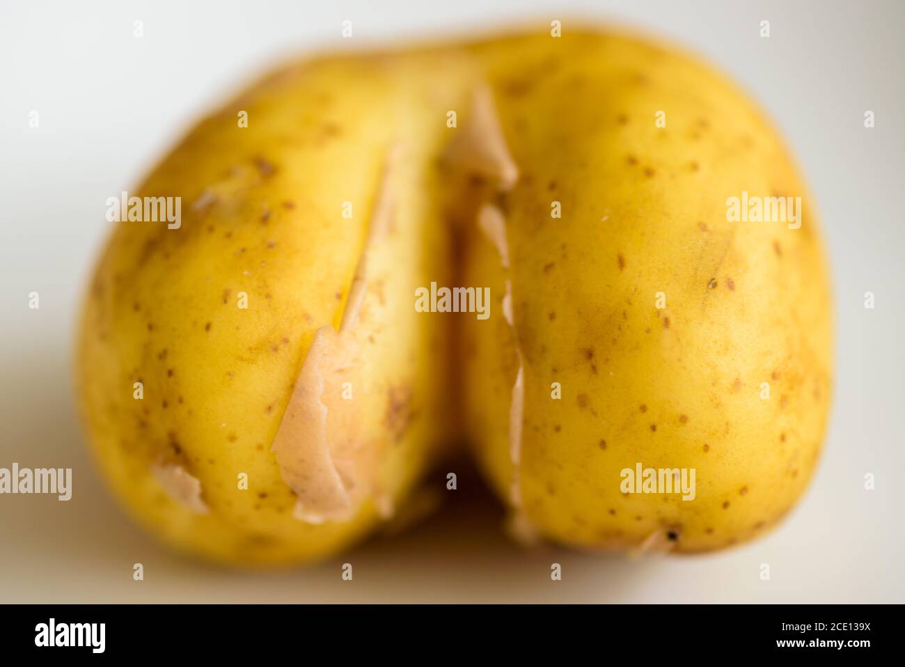 fun heart shape potato on bright background Stock Photo - Alamy