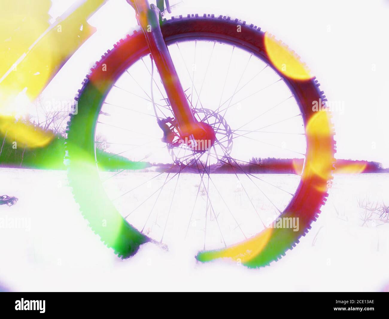 Abstract. Front bike detail on a winter trail, path covered by snow ...