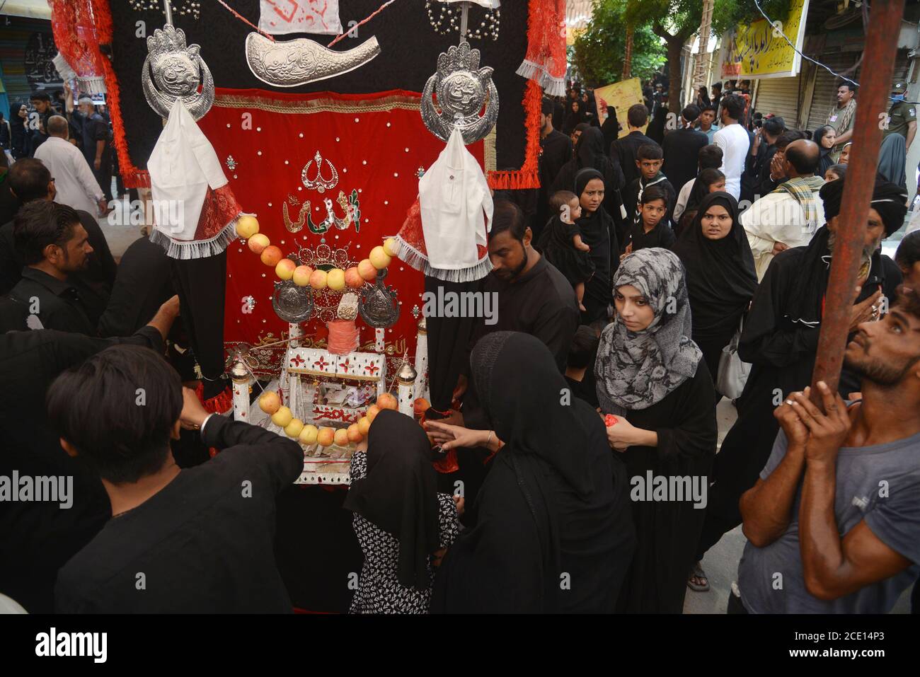 Pakistani Shiite Muslim take a part in mourning rituals to symbolize ...