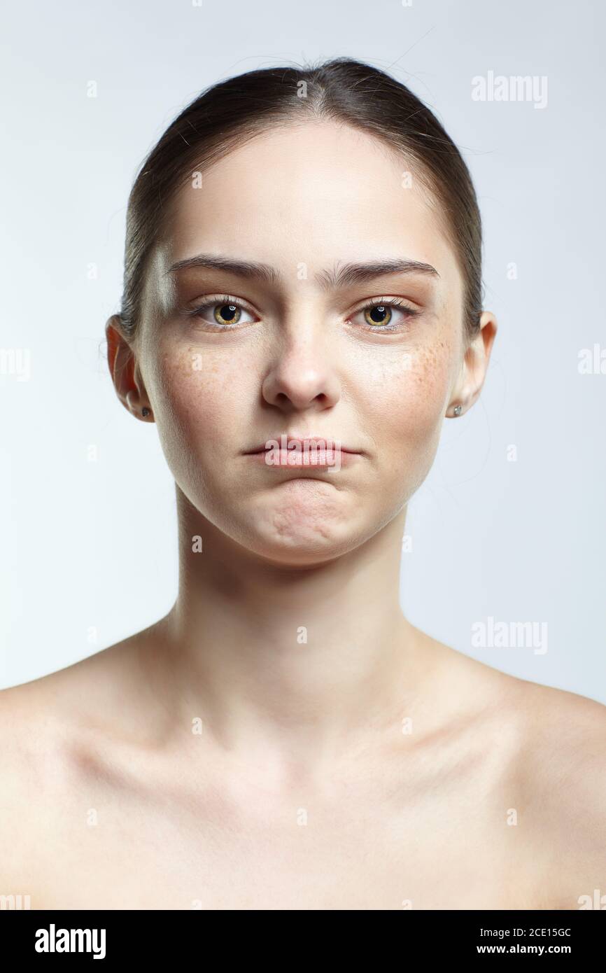 Headshot of emotional female face portrait with offended facial ...
