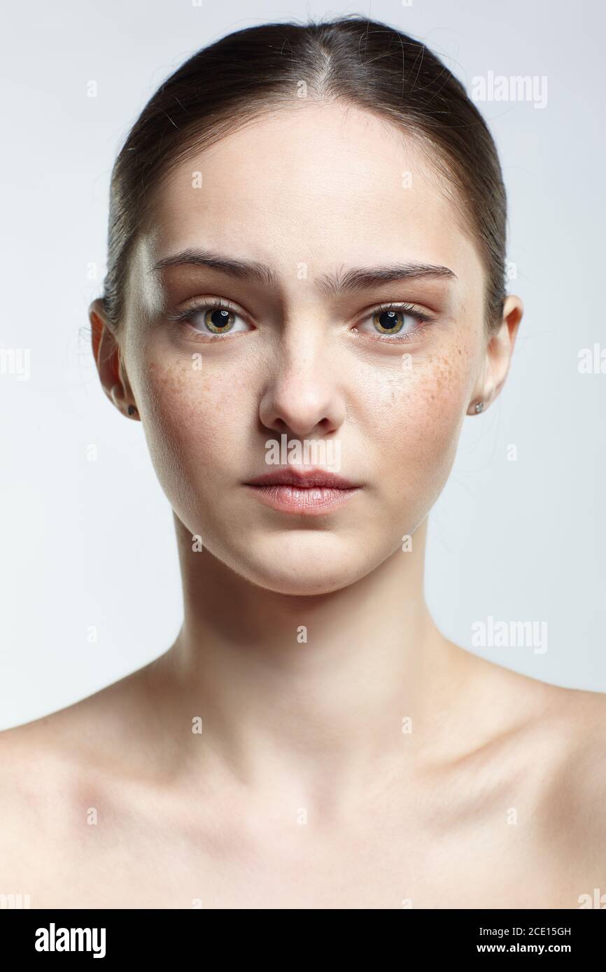 Headshot of emotional female face portrait with calm and tender facial ...