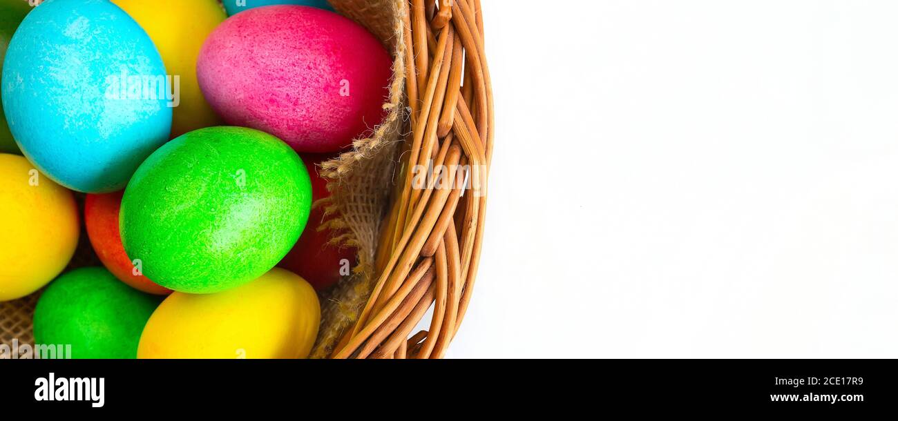 Colored decorated Easter eggs in basket Stock Photo - Alamy