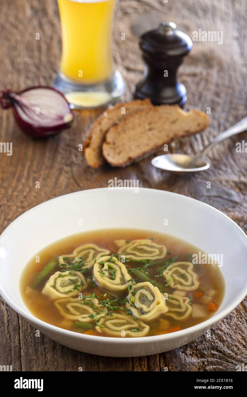 Bayerische maultaschensuppe auf holz hi-res stock photography and ...