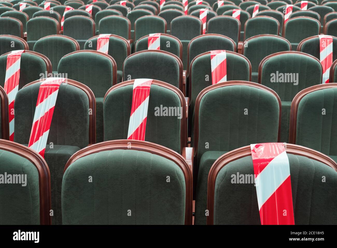 Need to sit on a chair separated by a ribbon in the cinema, theater ...
