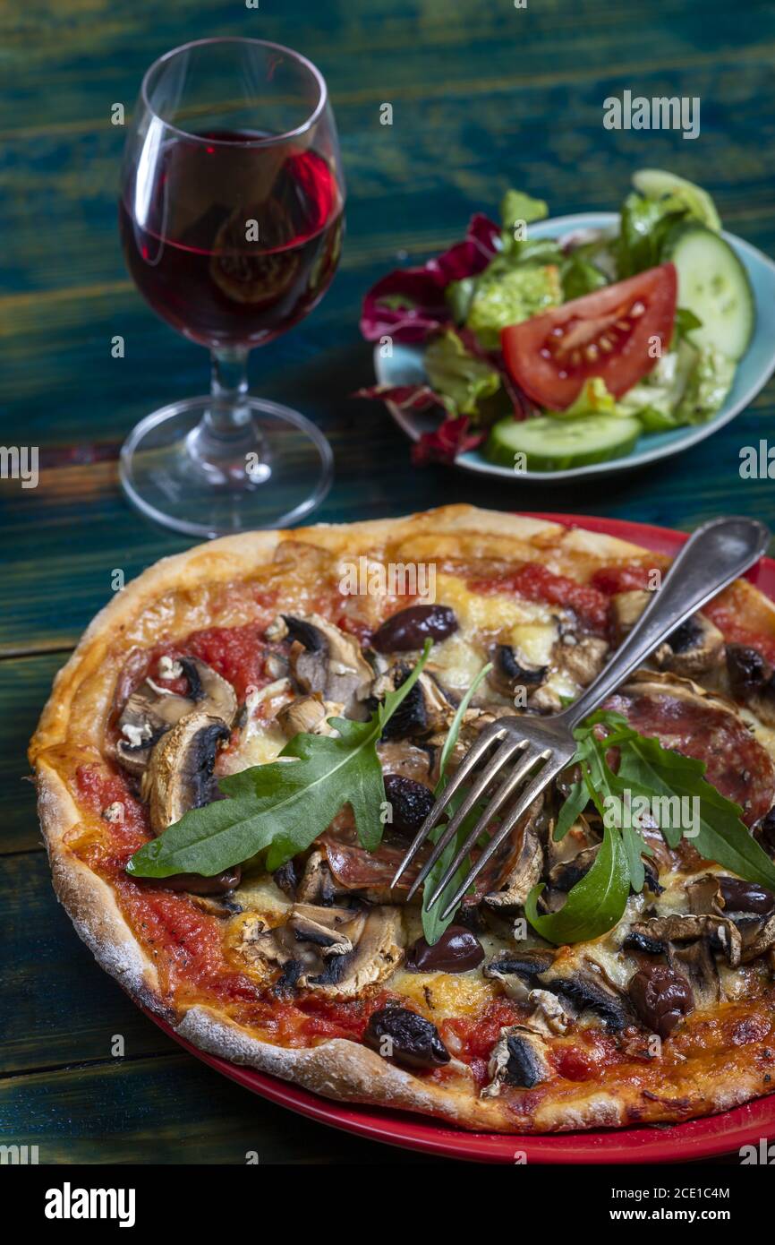 Pizza with Salat Stock Photo - Alamy