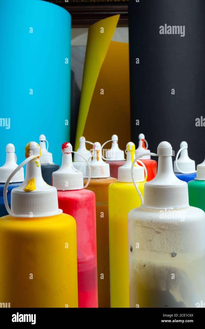 Colorful palette of acrylic paint tubes at artist studio. Choosing ...