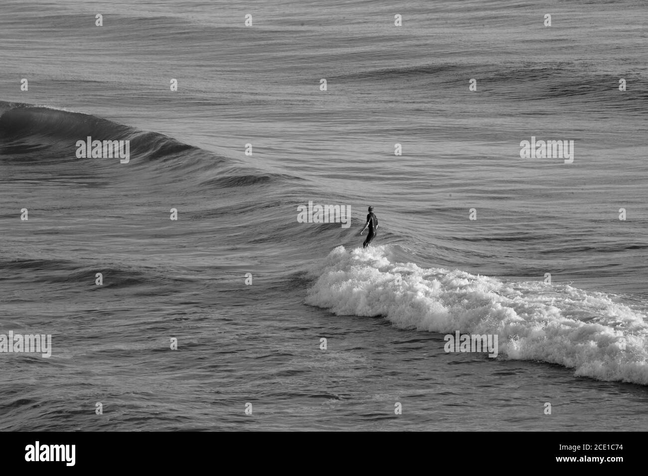 Surfer riding the Waves Stock Photo - Alamy