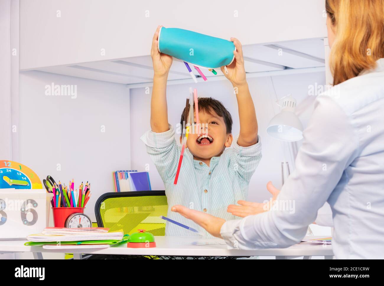 Boy with autism spectrum disorder throw pens and pencils negative ...