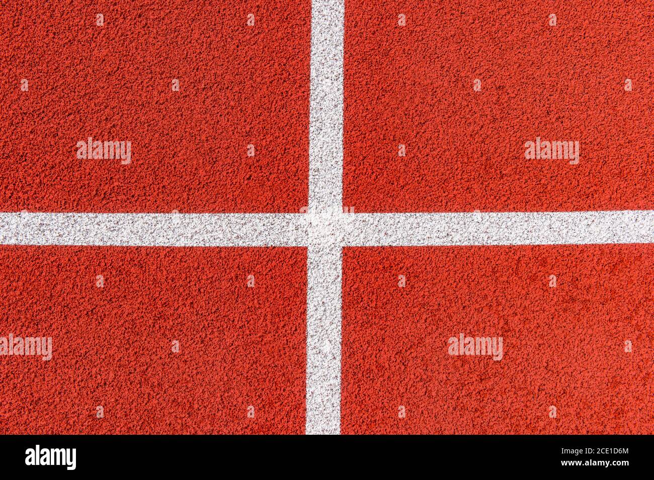 Close up on a white line in artificial red turf, on a street basketball ...