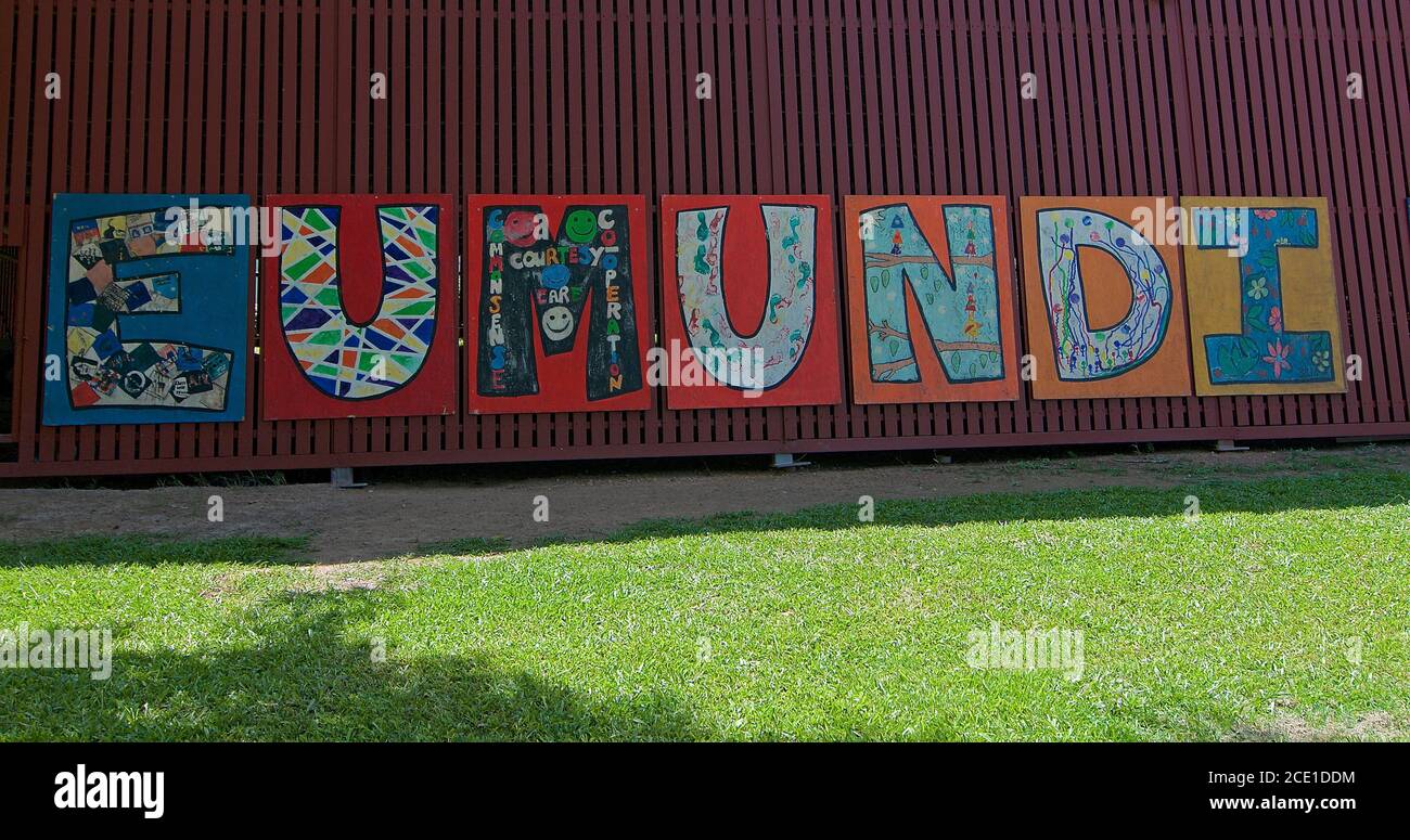 View of Eumundi town sign hanging on a building wall Stock Photo - Alamy