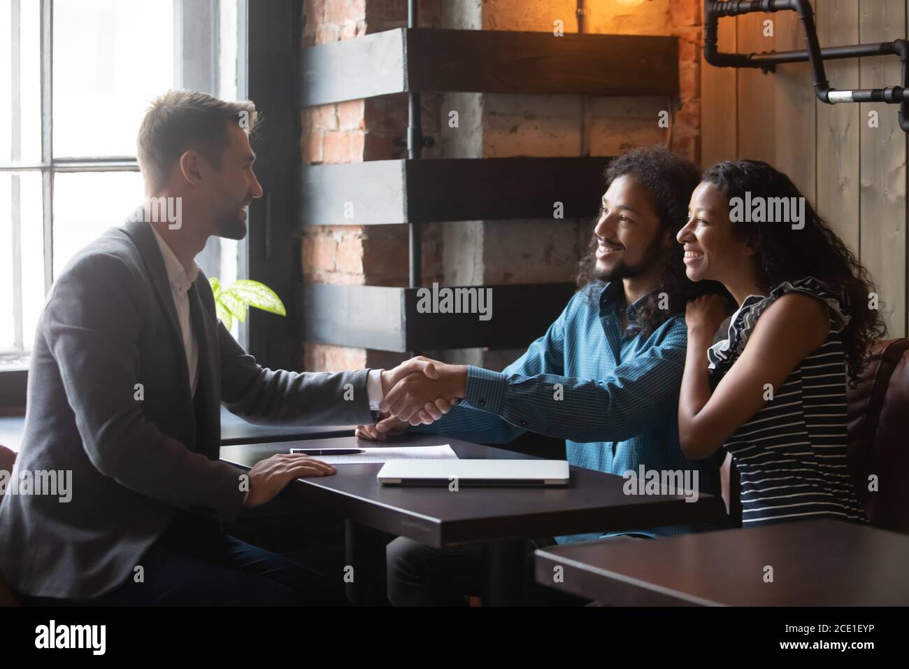 Satisfied young couple making hi-res stock photography and images - Alamy