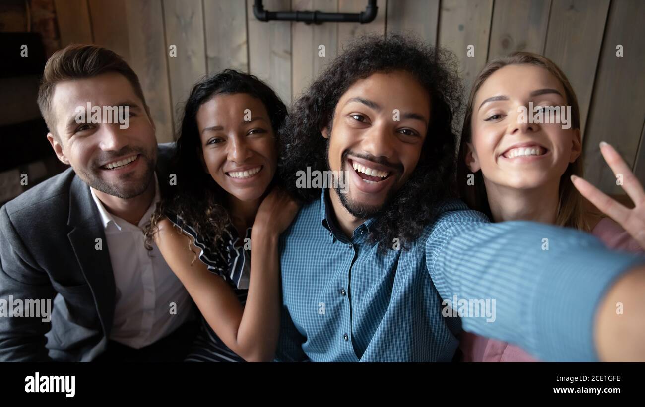 Head shot portrait smiling diverse people taking selfie together Stock ...