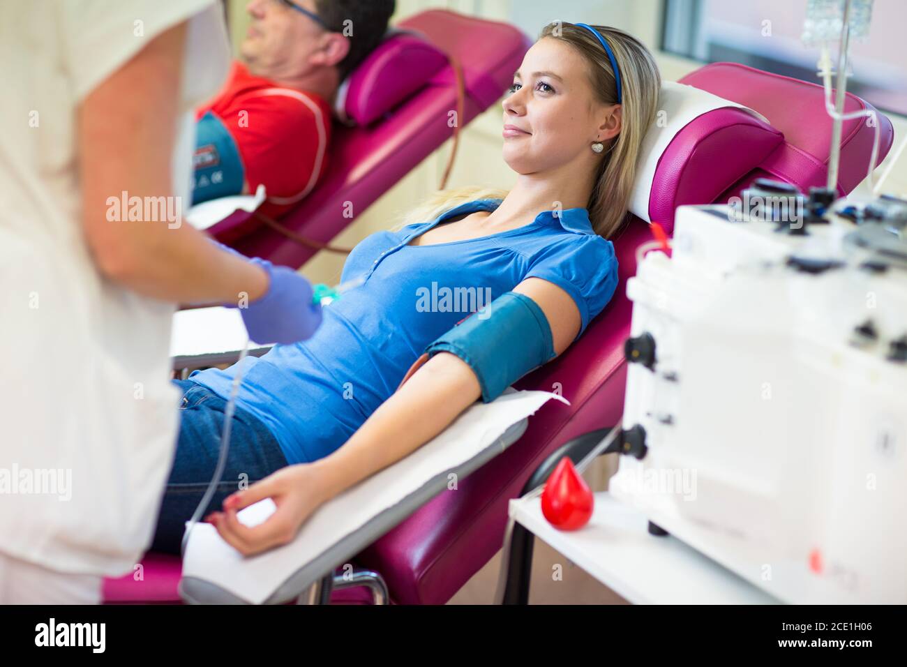 Young woman giving blood in a modern hospital (color toned image Stock ...