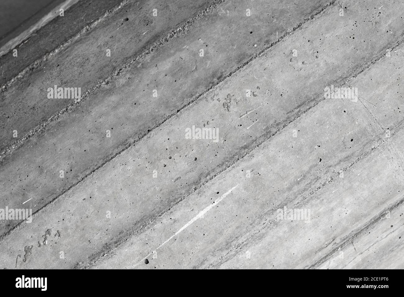 Grey concrete column background. Architectural detail with parallel ...