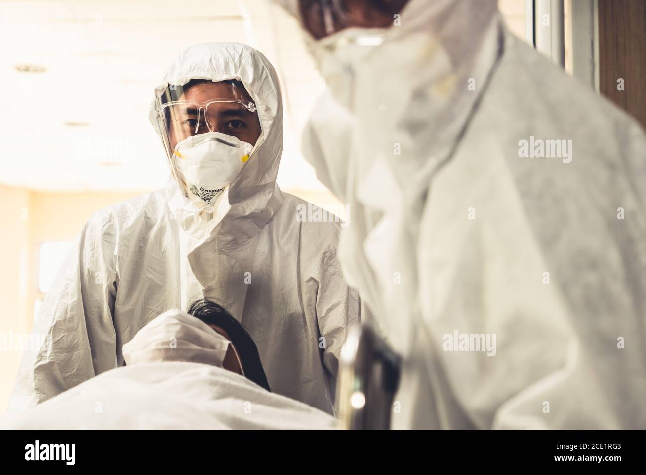 Emergency medic and doctor moving patient to emergency room Stock Photo ...