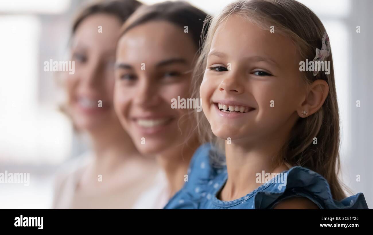 Cheerful different female generations family looking at camera Stock ...